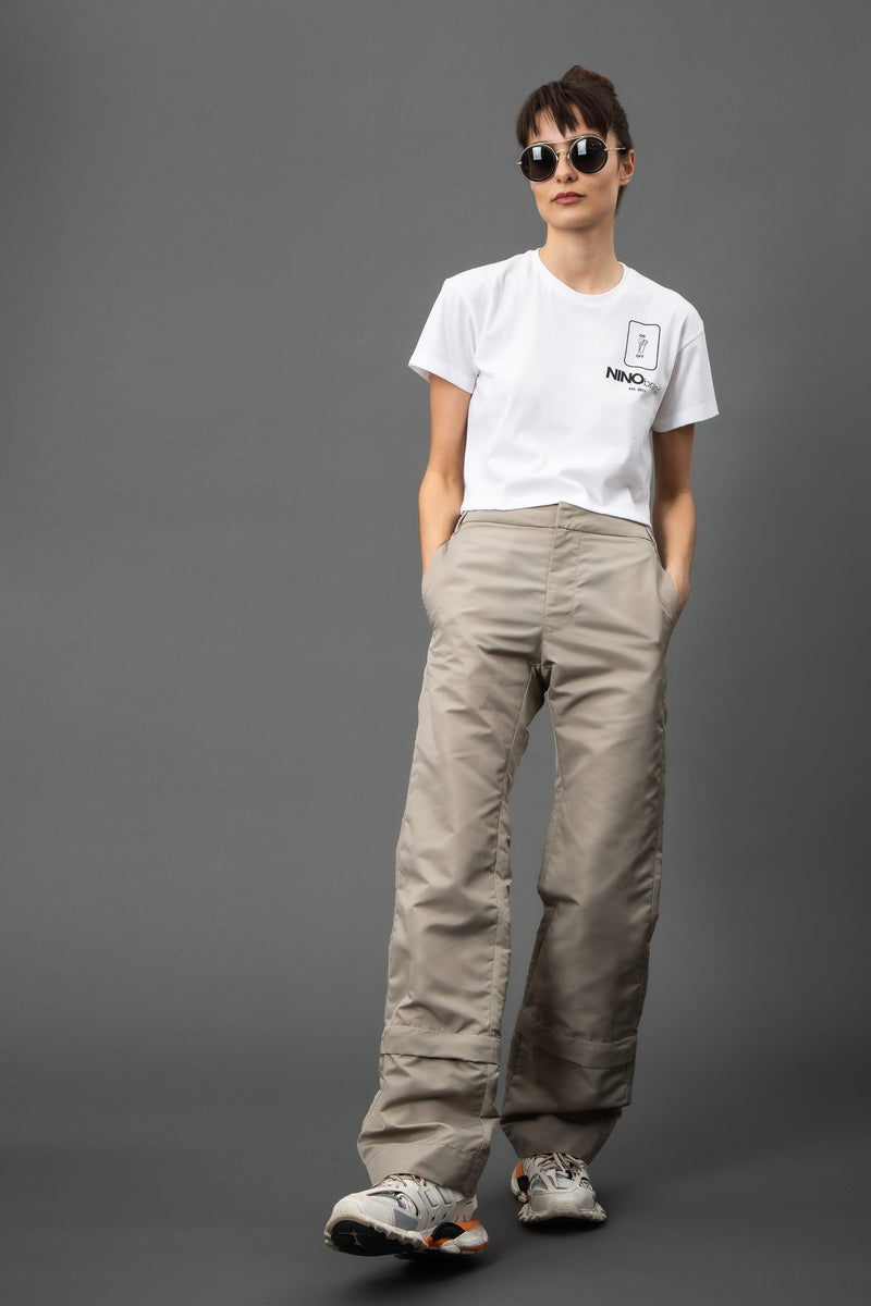 Sand tan color Pants in water resistant nylon with bottoms that unzipp ...